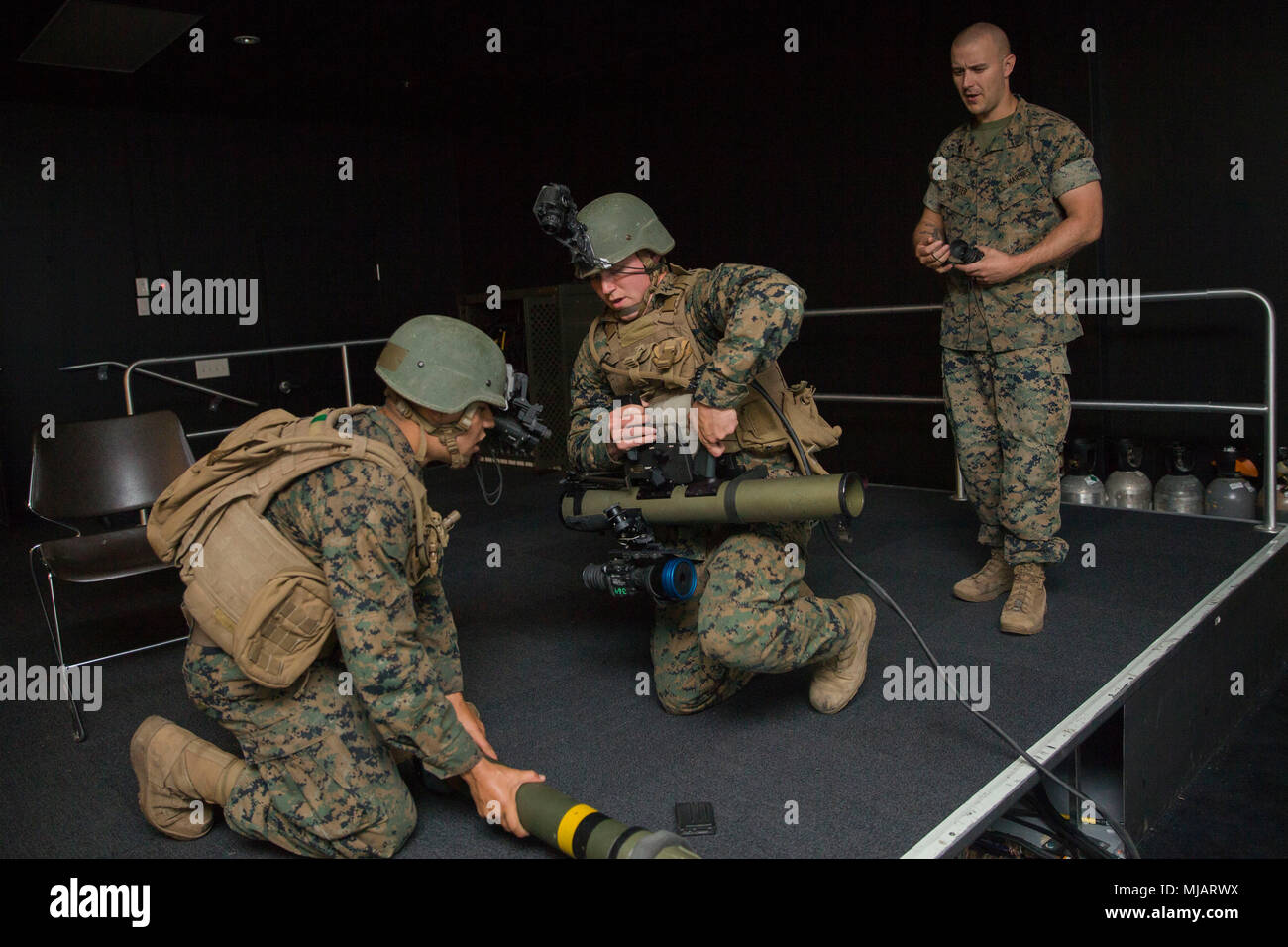 Sgt. Steven Carter, instructor, right, evaluates Pfc. Jeffery Felger ...