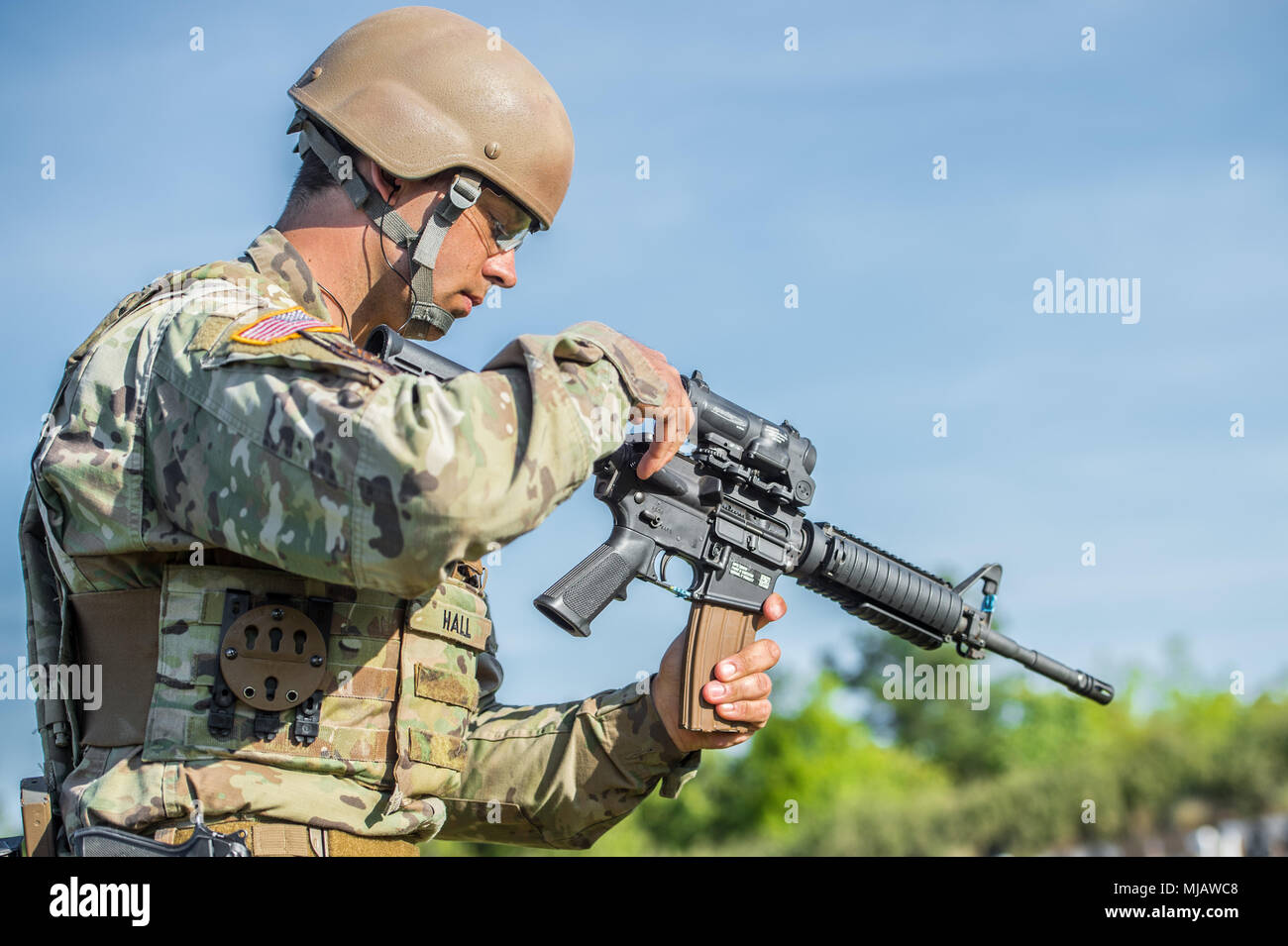Army National Guard Soldier prepares rifle for firing on range at the ...