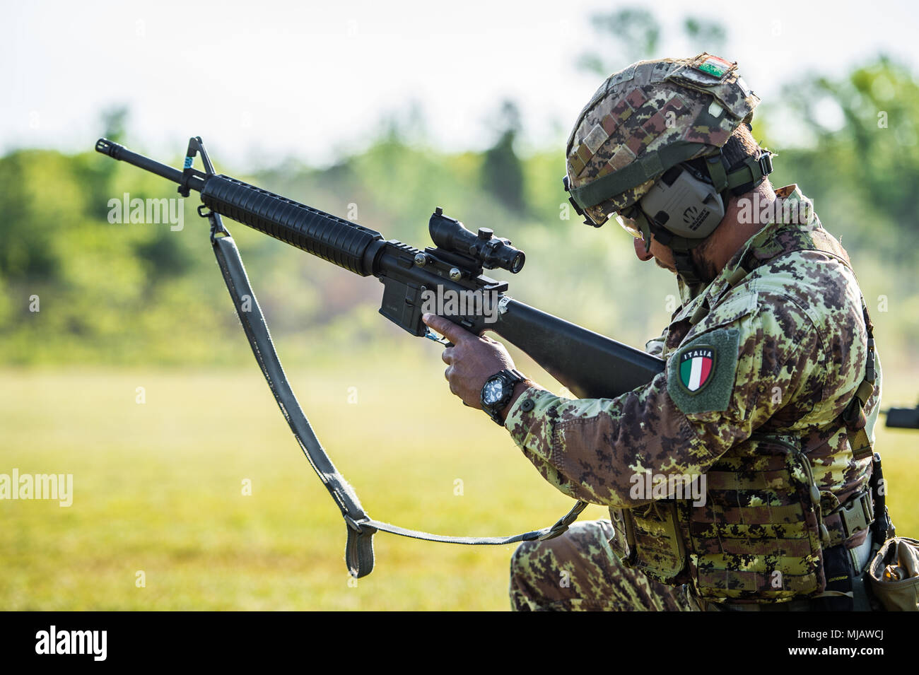 Italian Army Soldier loads M16 rifle while firing on range at the 47th ...