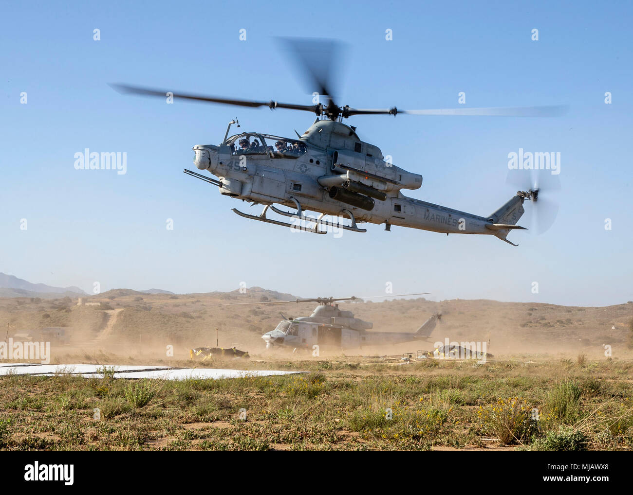 An AH-1Z Viper and a UH-1Y Venom with Marine Light Attack Helicopter ...