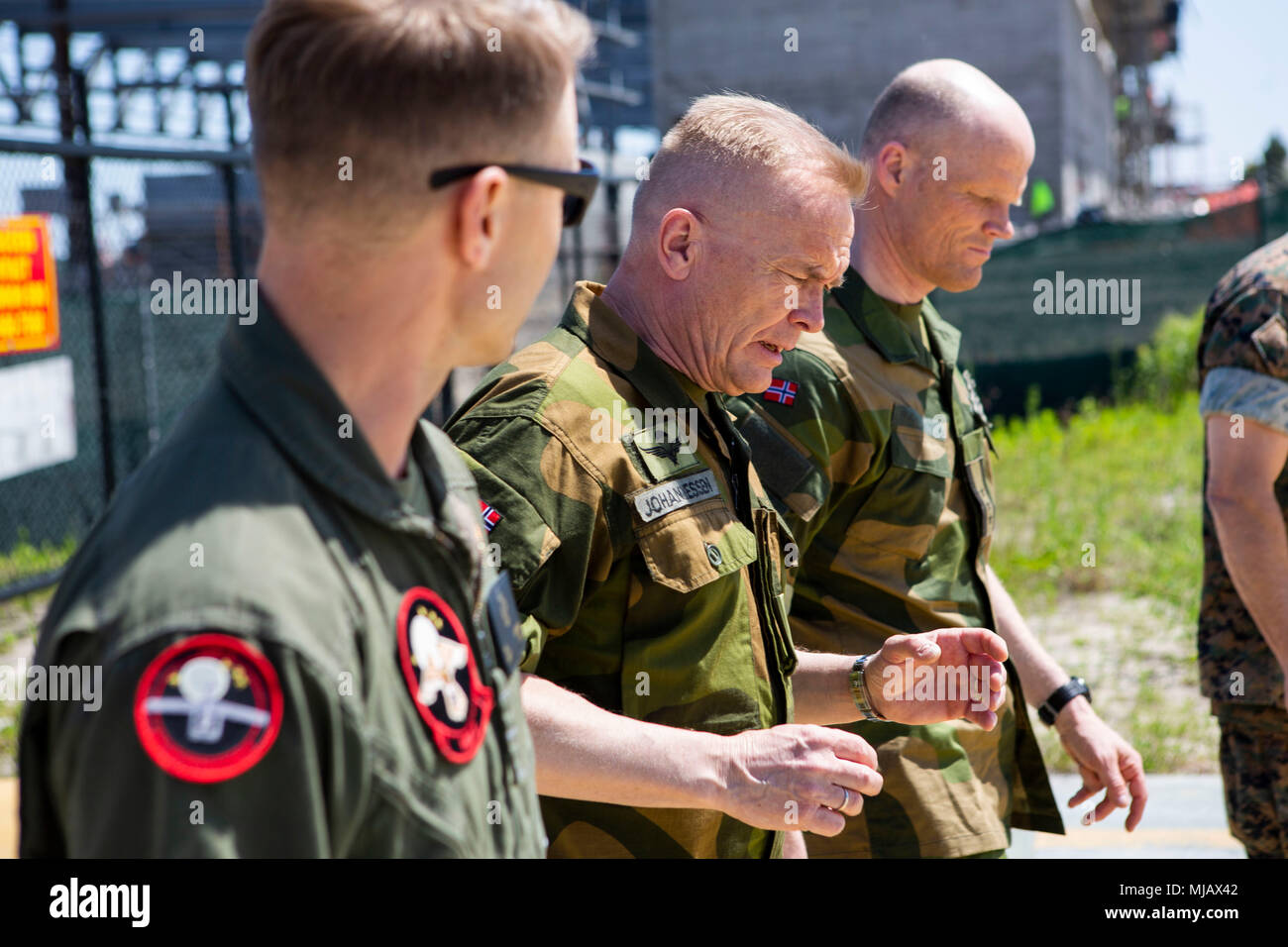 Maj. Gen. Odin Johannessen, center, is given a tour of Marine Unmanned ...