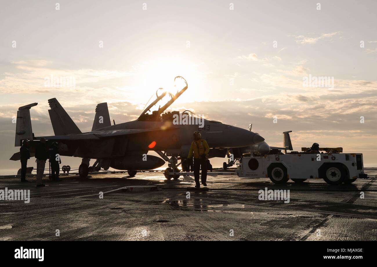 180427-N-FQ836-1058 ATLANTIC OCEAN (April 27, 2018) Sailors move an F/A ...