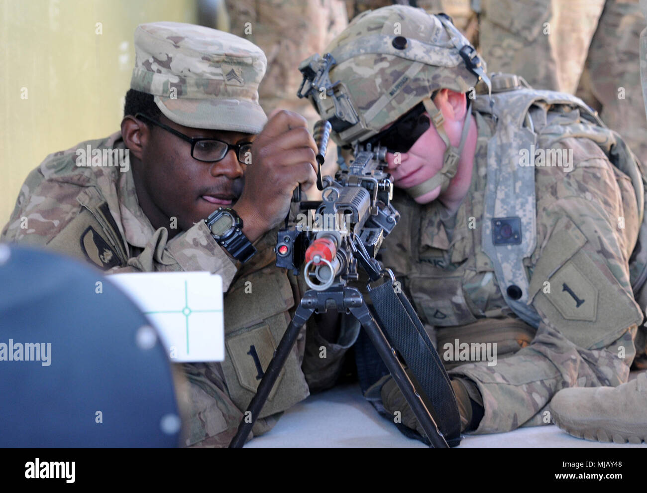 U.S. Army Sgt. Paul Hewitt (left), assigned to 82nd Brigade Engineer ...