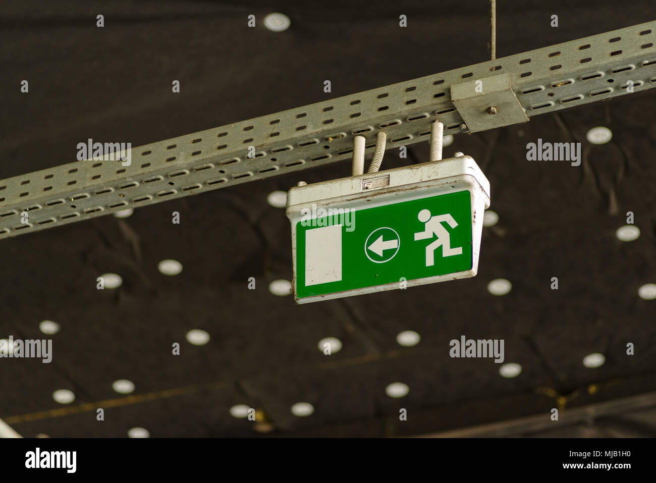 Person hanging evacuation sign hi-res stock photography and images - Alamy