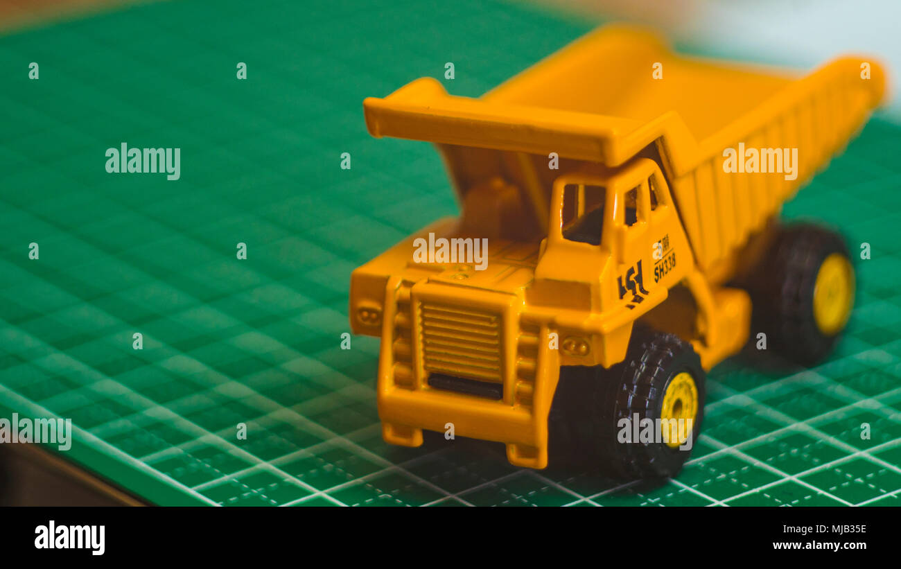 Toy Construction machine, cars and items Stock Photo - Alamy