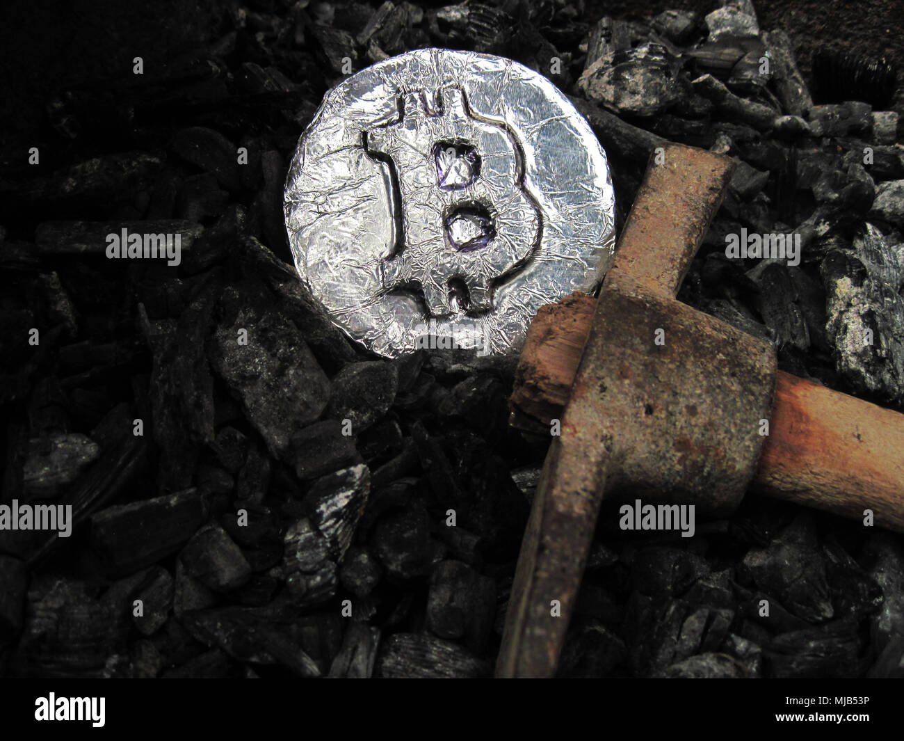 Bitcoin mining. A mine with real hardware. Symbols of block chain ...