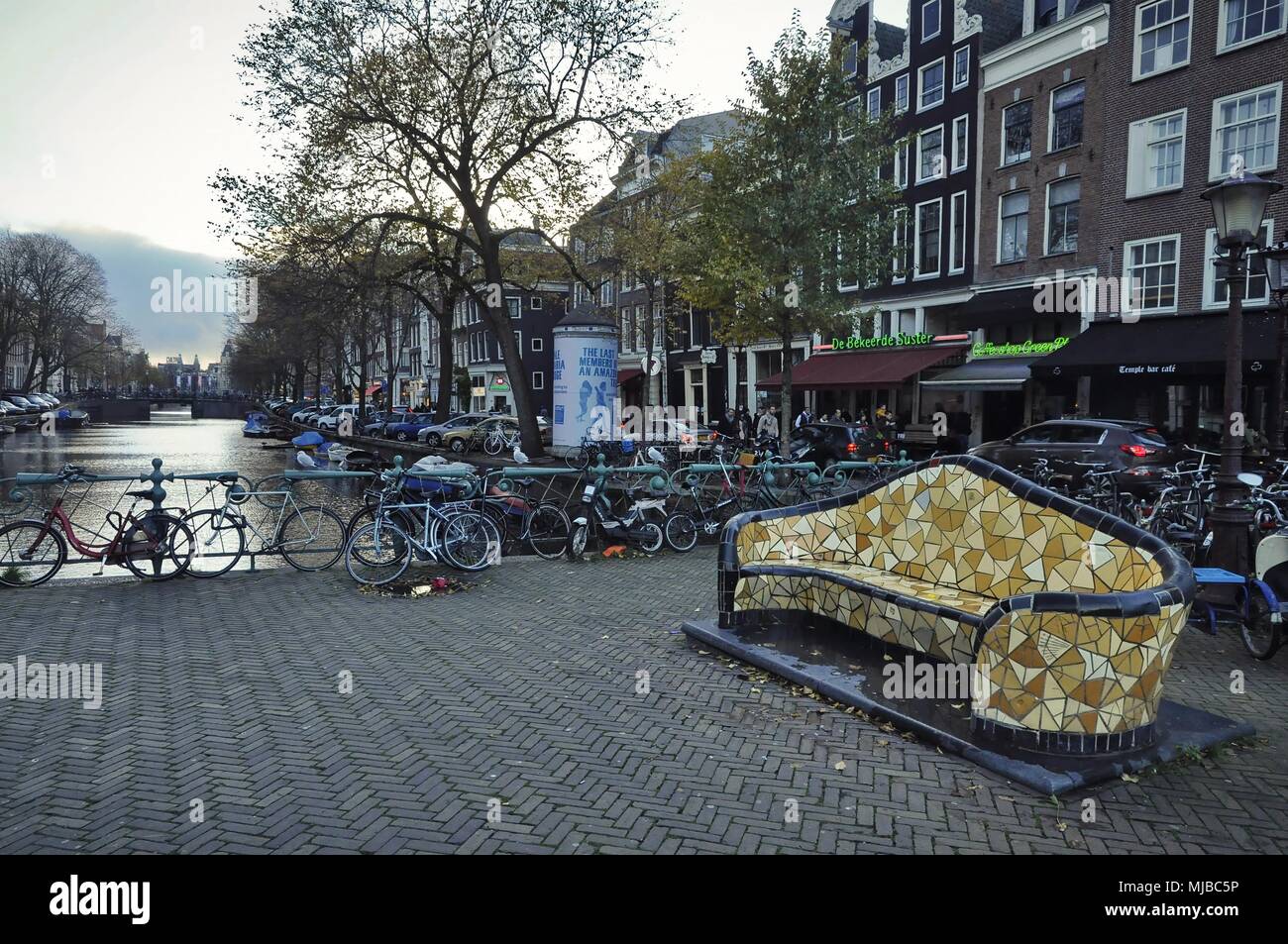 Amsterdam, Netherlands: A sitting bench decorated with yellow and black ...