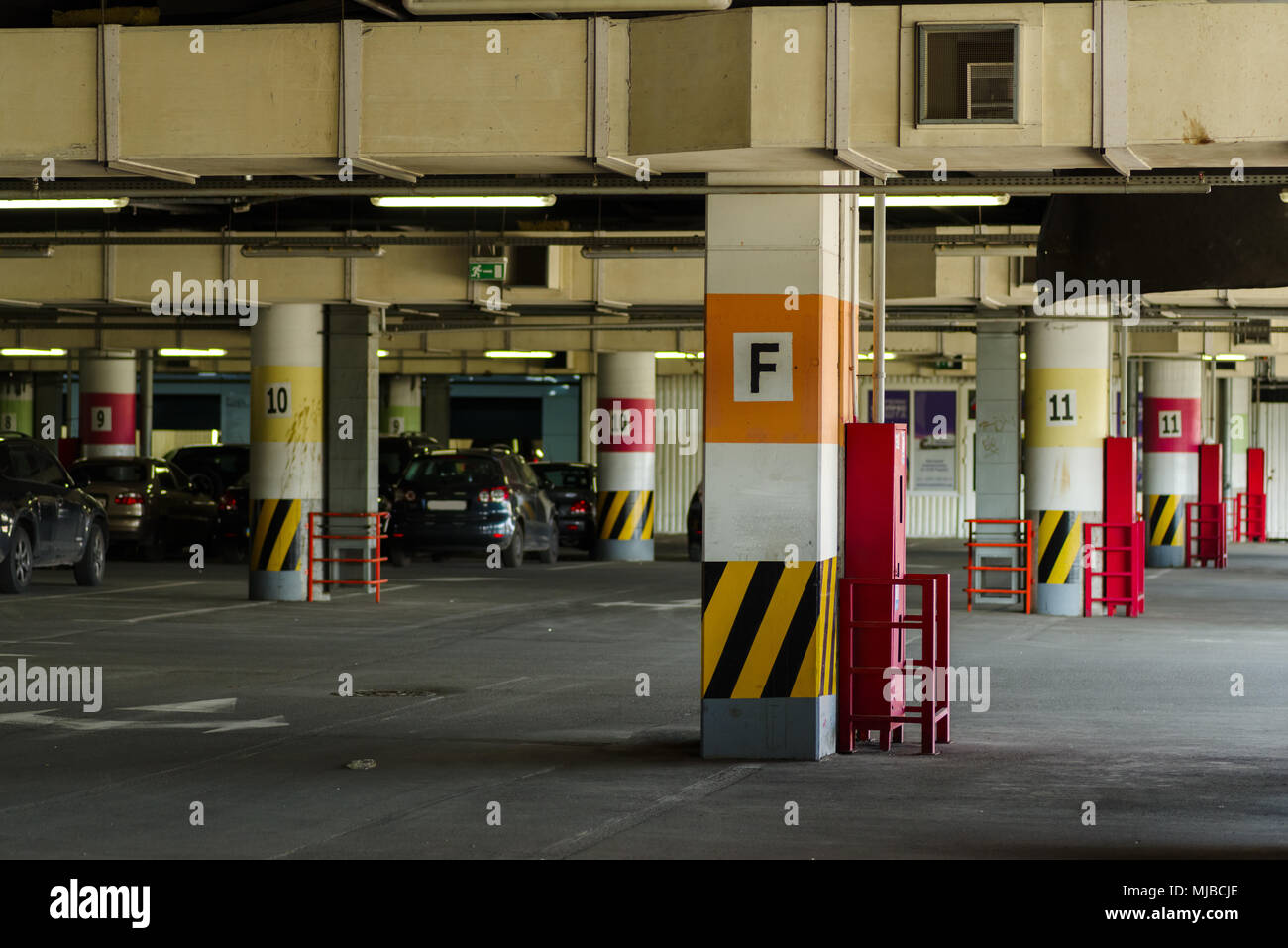 multi-deck underground parking with markings of rows on pillars Stock ...