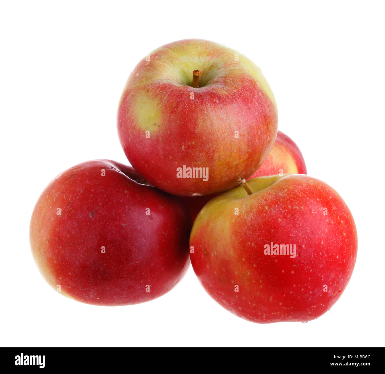 Four ripe red apples stacked in a pyramid, isolated on white background ...