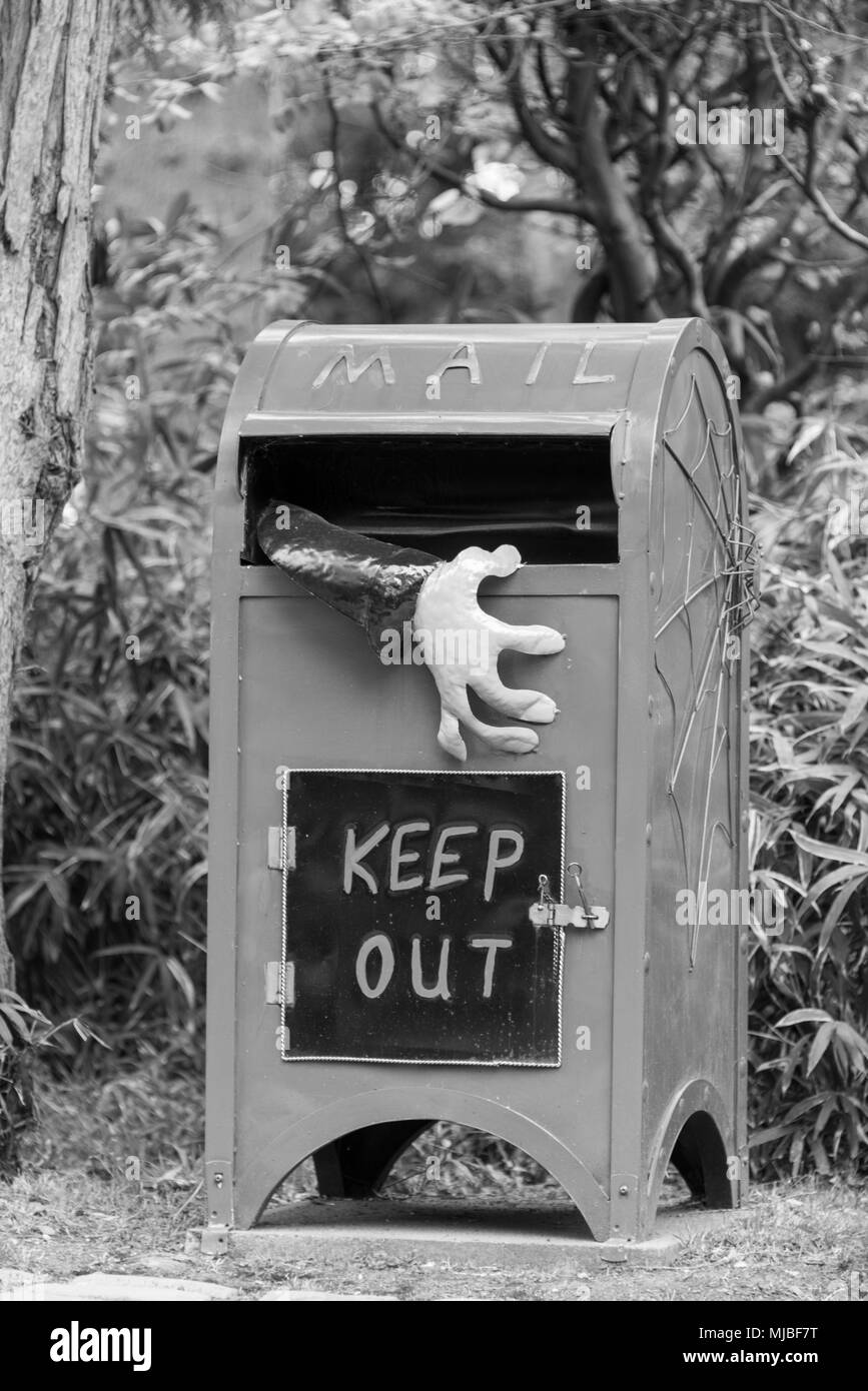 Halloween mail box with purple pink monster hand protruding from the ...