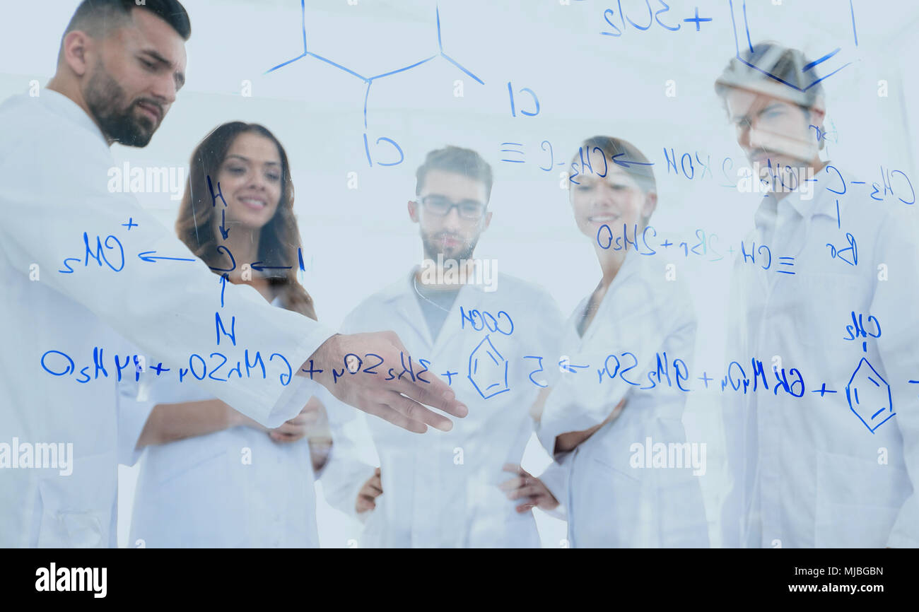 in the background image group laboratory scientists discussing their ...