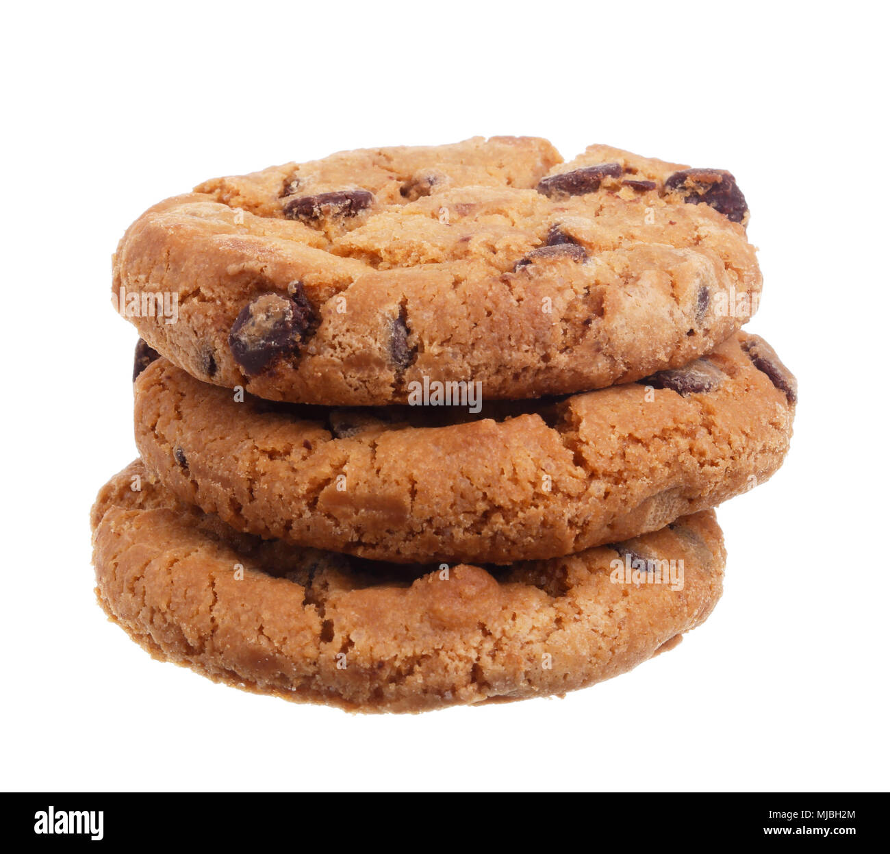 Three chocolate chip cookies in a pile isolated on white background ...