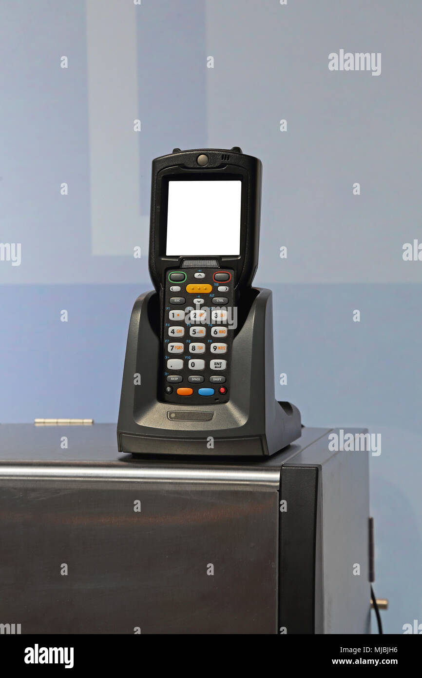 Handheld Laser Barcode Reader and Scanner at Charger Dock Stock Photo ...