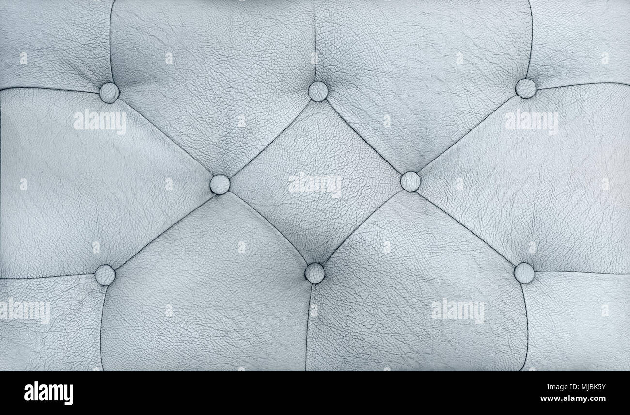 Coach-type screed. Retro light coloured chesterfield style quilted ...