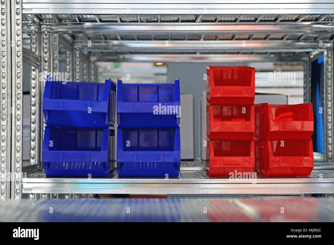 Plastic Trays for Sorting at Shelf in Storage Room Stock Photo - Alamy