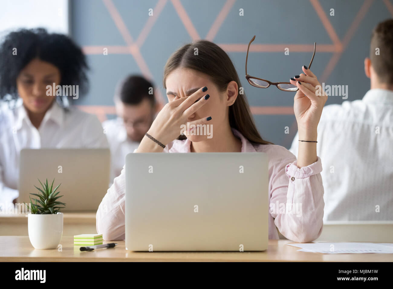 Woman taking off glasses tired of work, eyes fatigue concept Stock ...