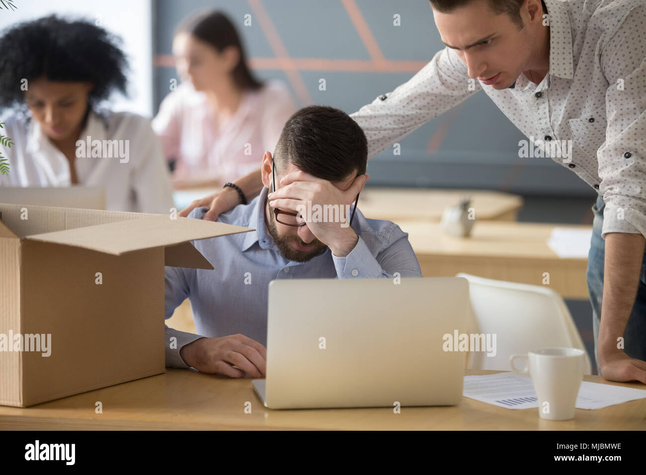 Businessman supporting colleague hi-res stock photography and images ...