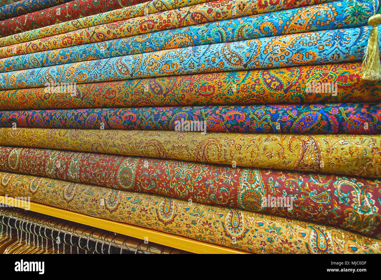 The stack of beautiful colorful textile in cloths stall of Grand Bazaar ...