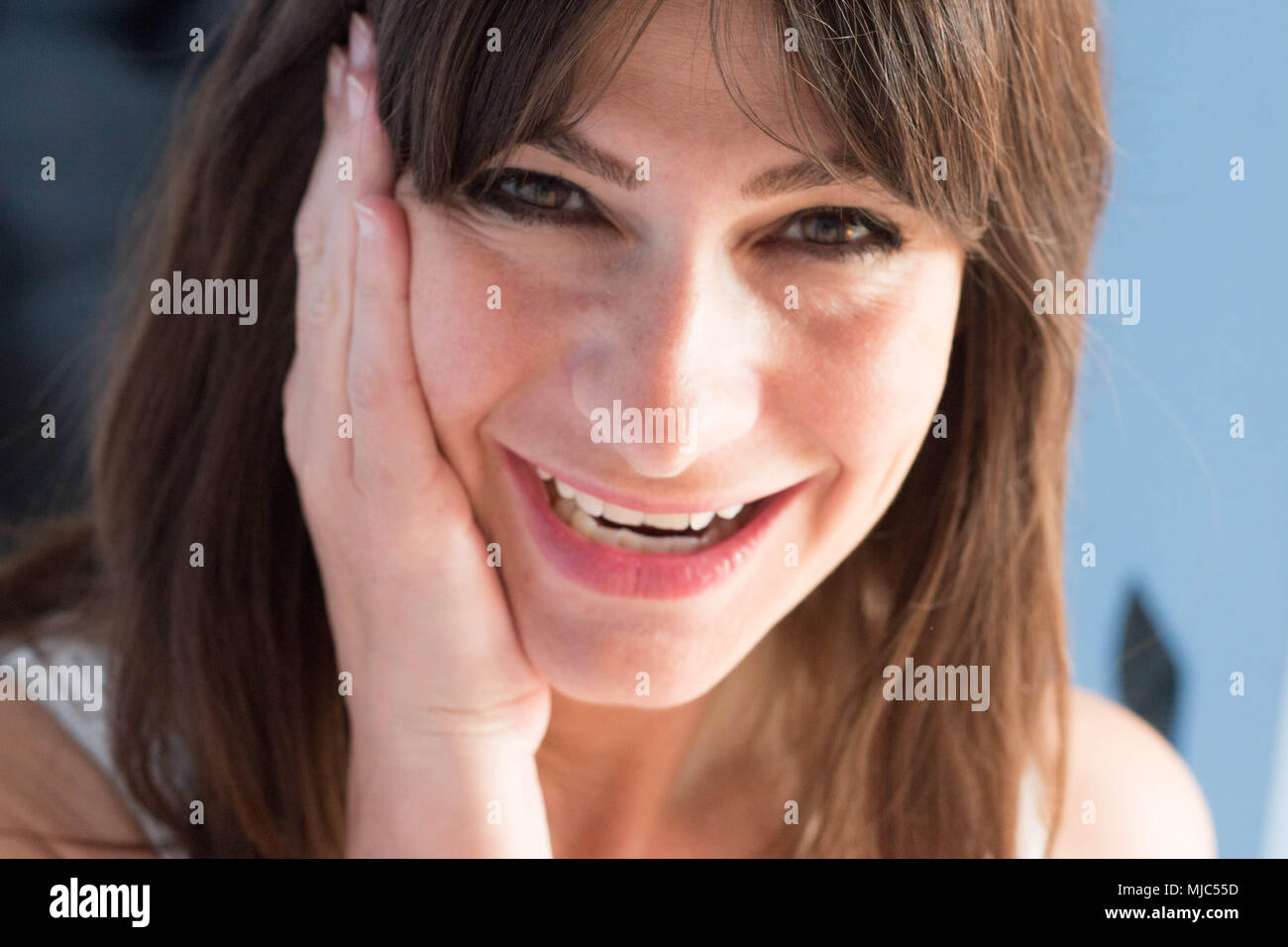 close up portrait of caucasian young woman with dark long hair and ...