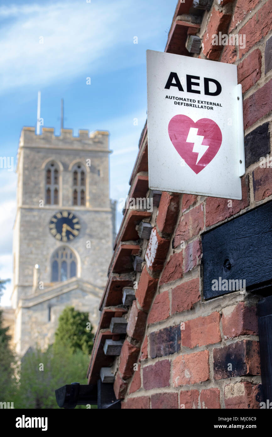 Defibrillator signs and location in rural areas Stock Photo - Alamy