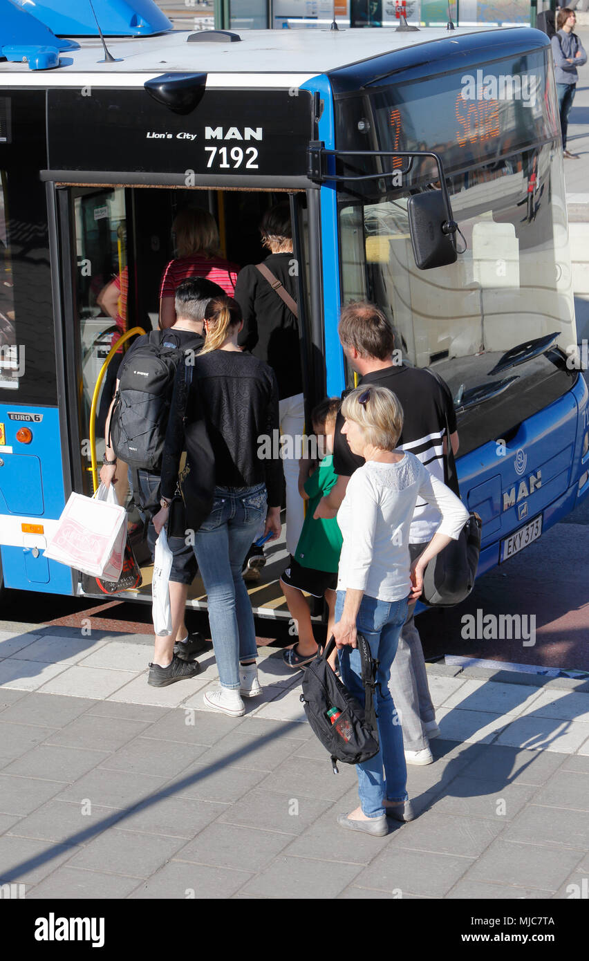 Stockholm, Sweden - June 2, 2016: People boarding a blue city bus on ...