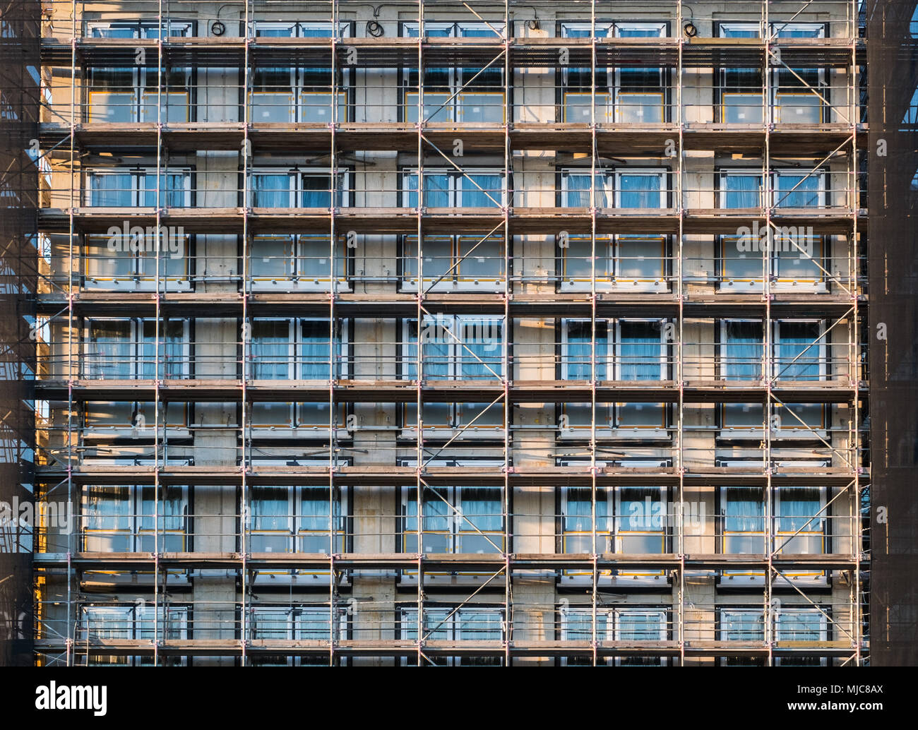 scaffolding on facade, new building under construction Stock Photo - Alamy