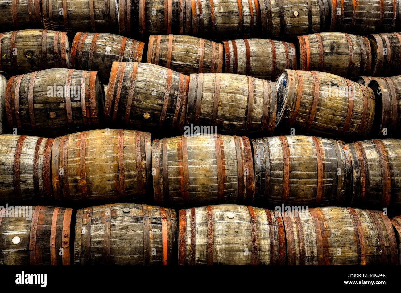 Stacked pile of old whisky and wine wooden barrels and casks Stock ...