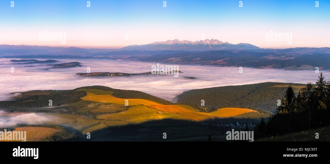 Panoramic landscape view of meadows, Spis castle and High Tatras ...