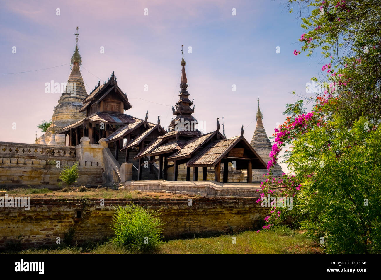 Beautiful view of ancient temple in old Bagan with flowers foreground ...