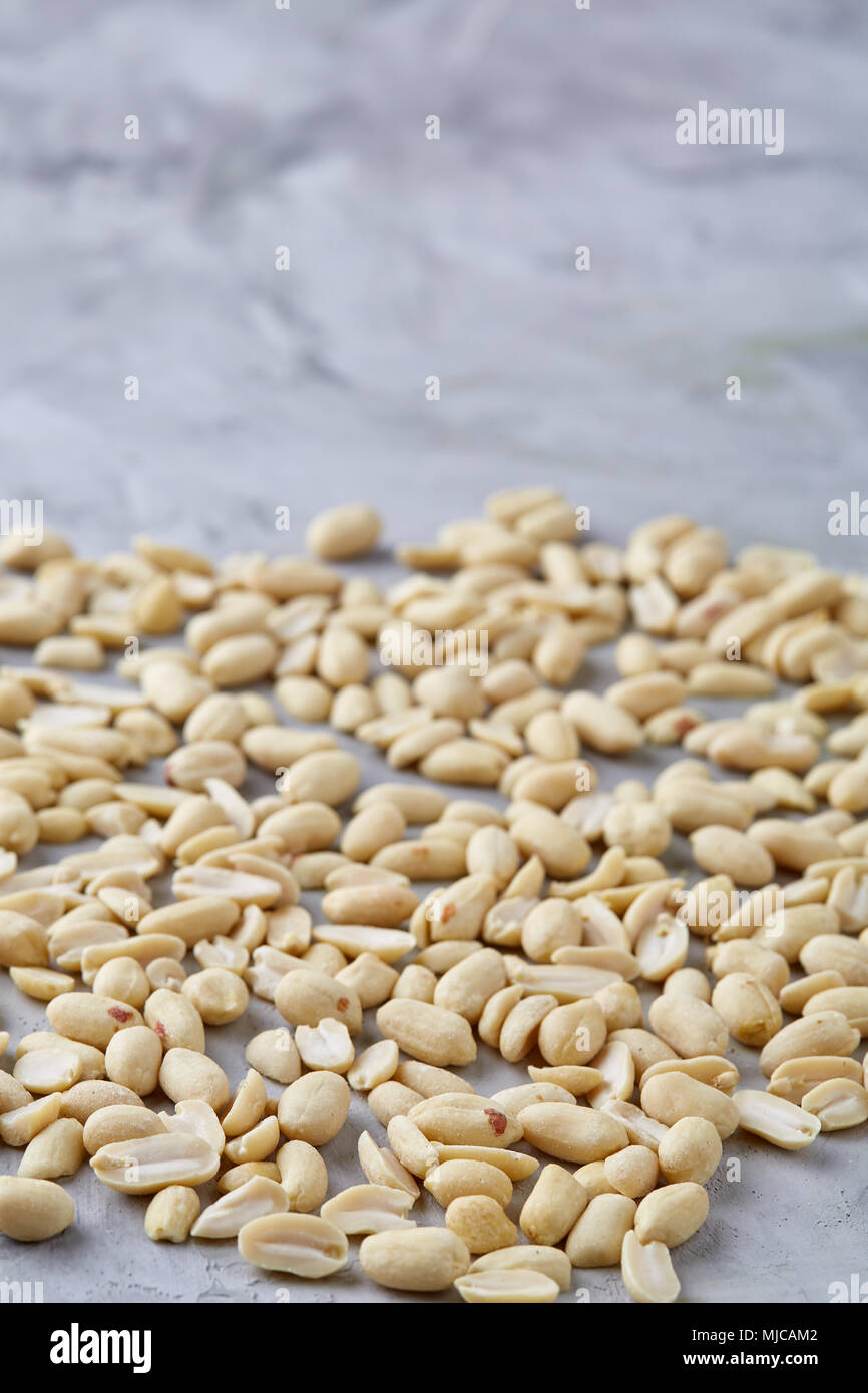 Pile of peelled peanuts isolated on white textured background ...