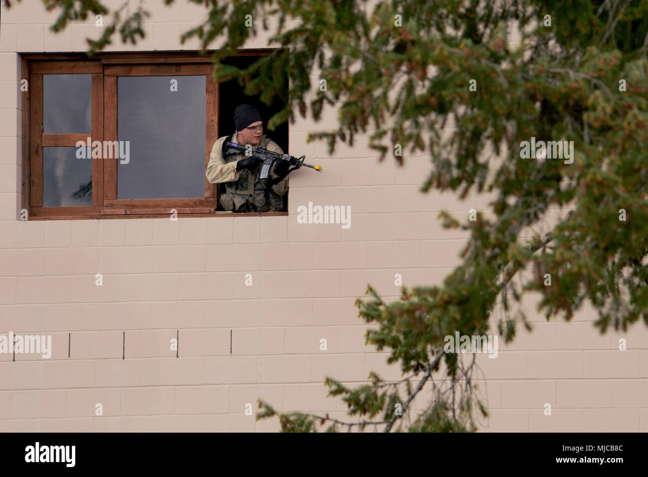 U.S. Army Soldiers play the role of enemy combatants as they move to ...