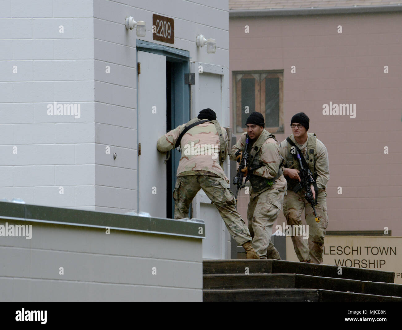 U.S. Army Soldiers play the role of enemy combatants as they move to ...