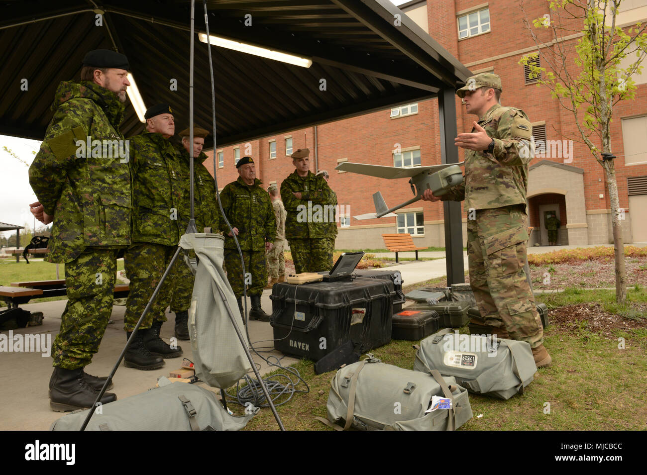 Oregon Army National Guard Sgt. Paul Mannelly (right) a scout platoon ...