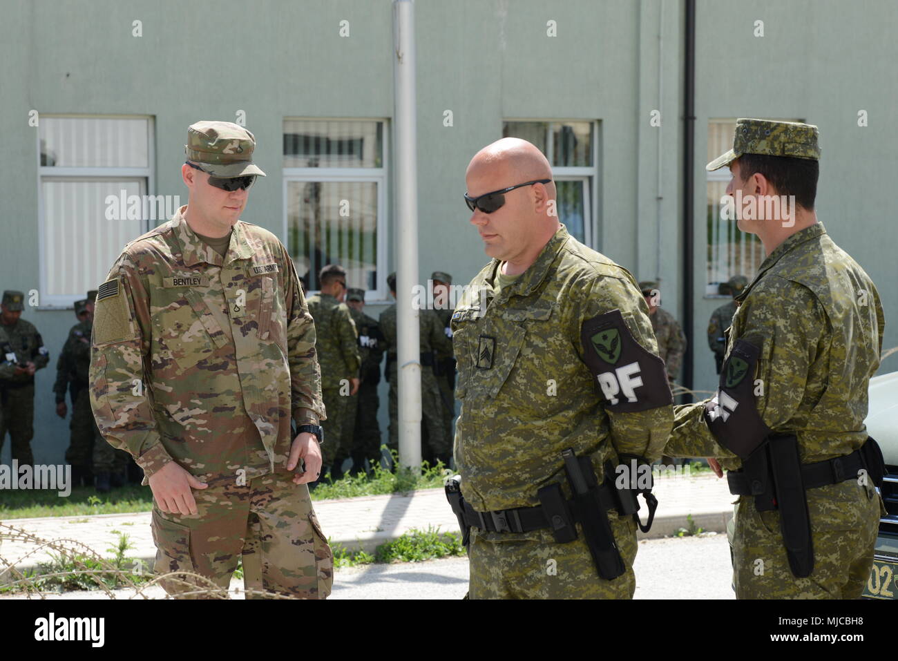 Spc. Allen Bentley, 287th Military Police, Fort Riley Kansas, assists ...