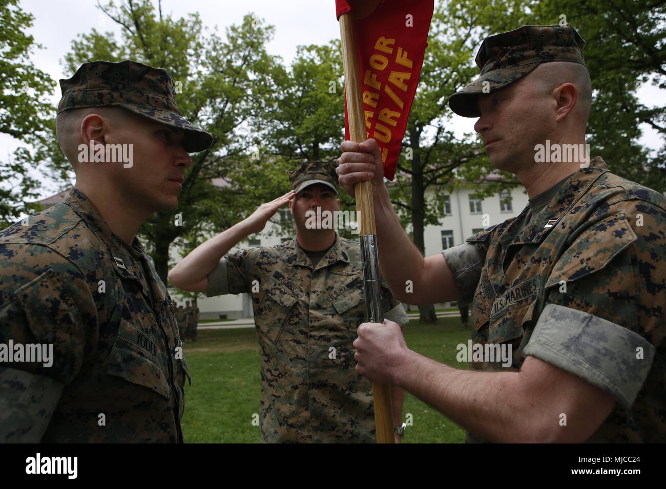 U.S. Marine Capt. George Chronis presents the unit colors for ...