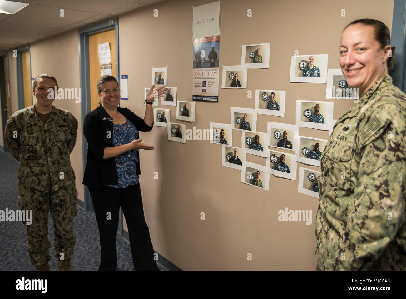 Navy Marine Corps Relief Society Director Gillian Connon (center), Lt ...