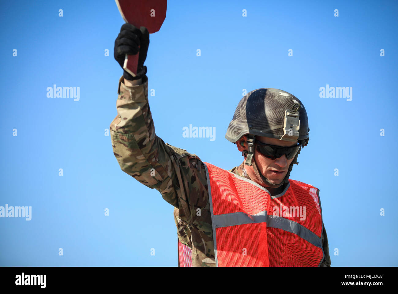 A U.S. Army National Guard Soldier signals to the tower that shooters ...