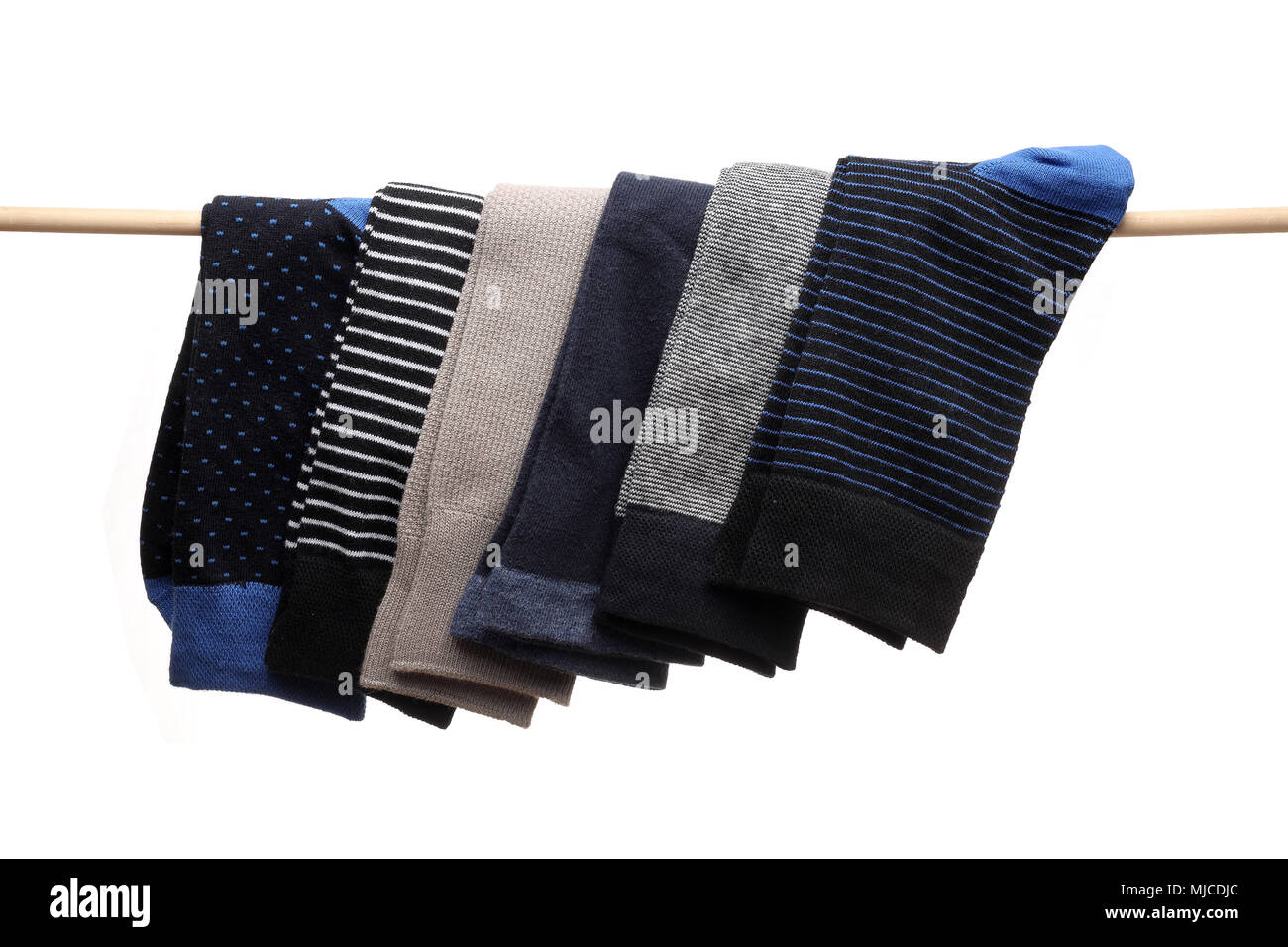 Socks hanging from Stik Stock Photo - Alamy