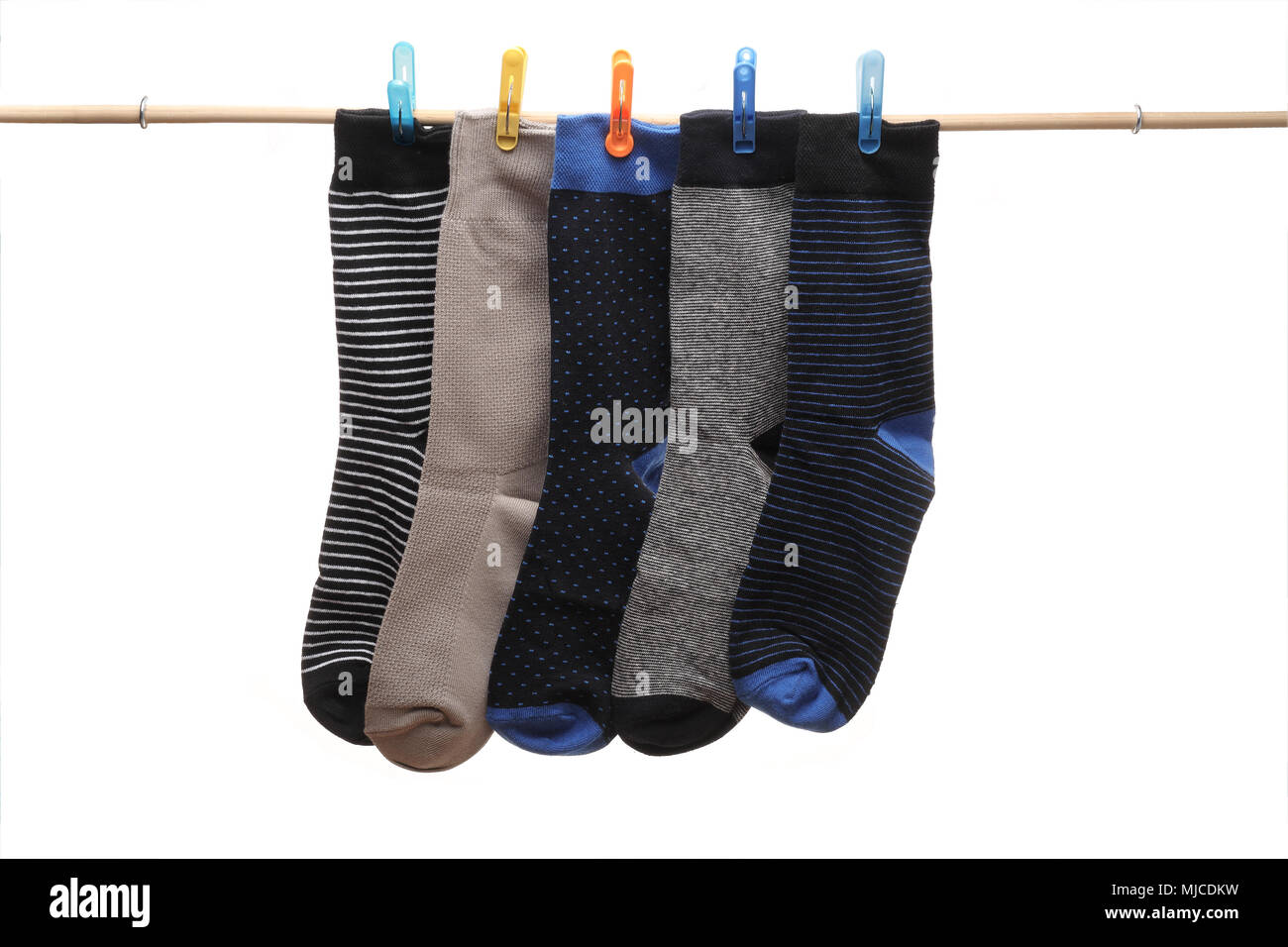 Socks Hanging from Stick Stock Photo - Alamy