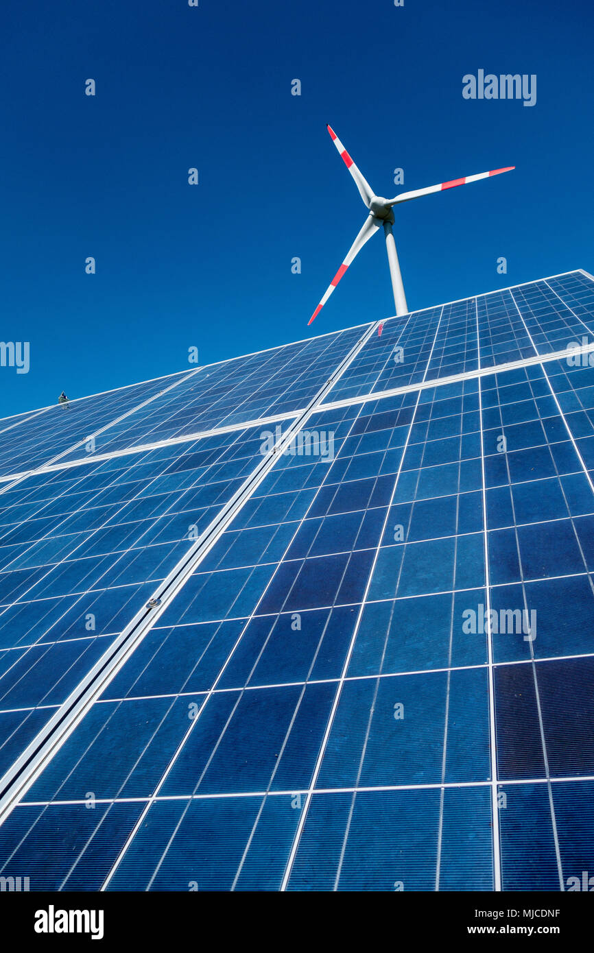 a combination of windpower and solarpower, windmill and solarpanel ...