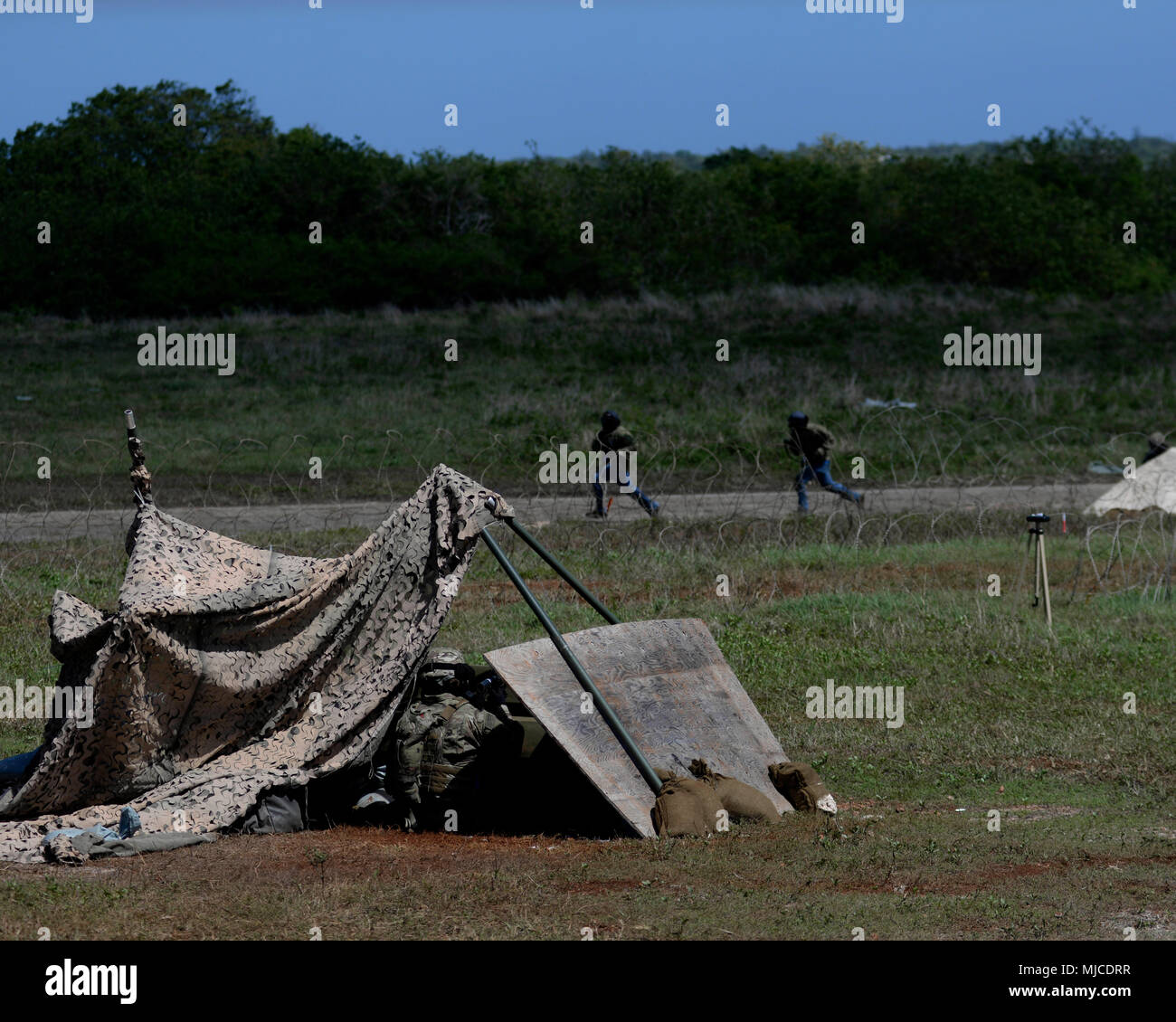Airmen from the 644th Combat Communications Squadron fire on opposing ...