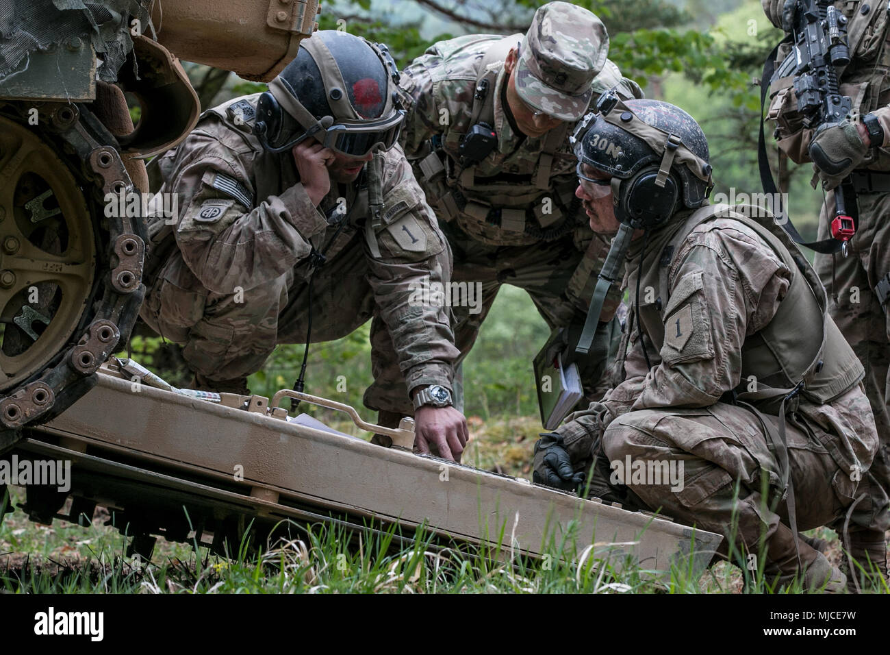 Capt. Andrew Ogle (left), an infantry officer assigned to 1st Battalion ...