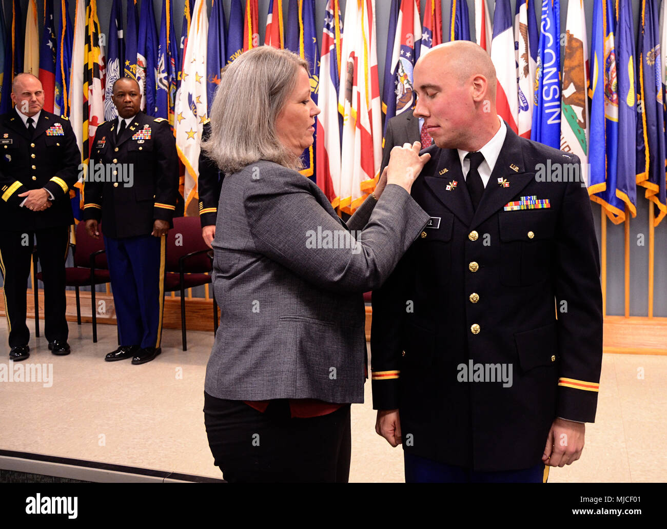 The mother of 2nd Lt. Aleksei Matel pins lieutenant bars to his ...