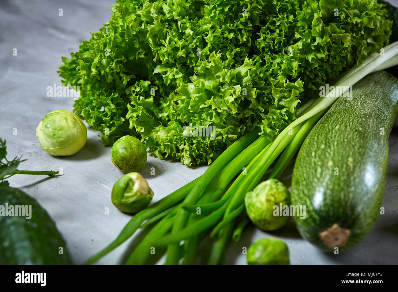Fresh vegetables still life over white textured background, close-up ...