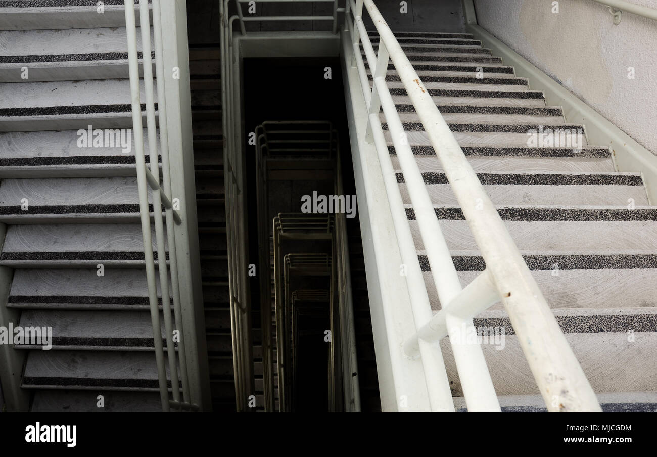 Dirty emergency stairs in the old skyscraper with deep abyss view Stock ...