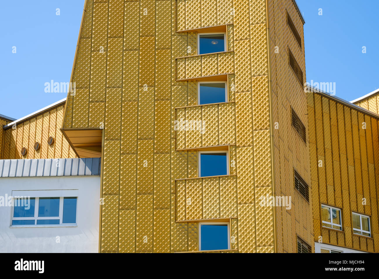 building exterior with golden facade and blue sky background Stock ...