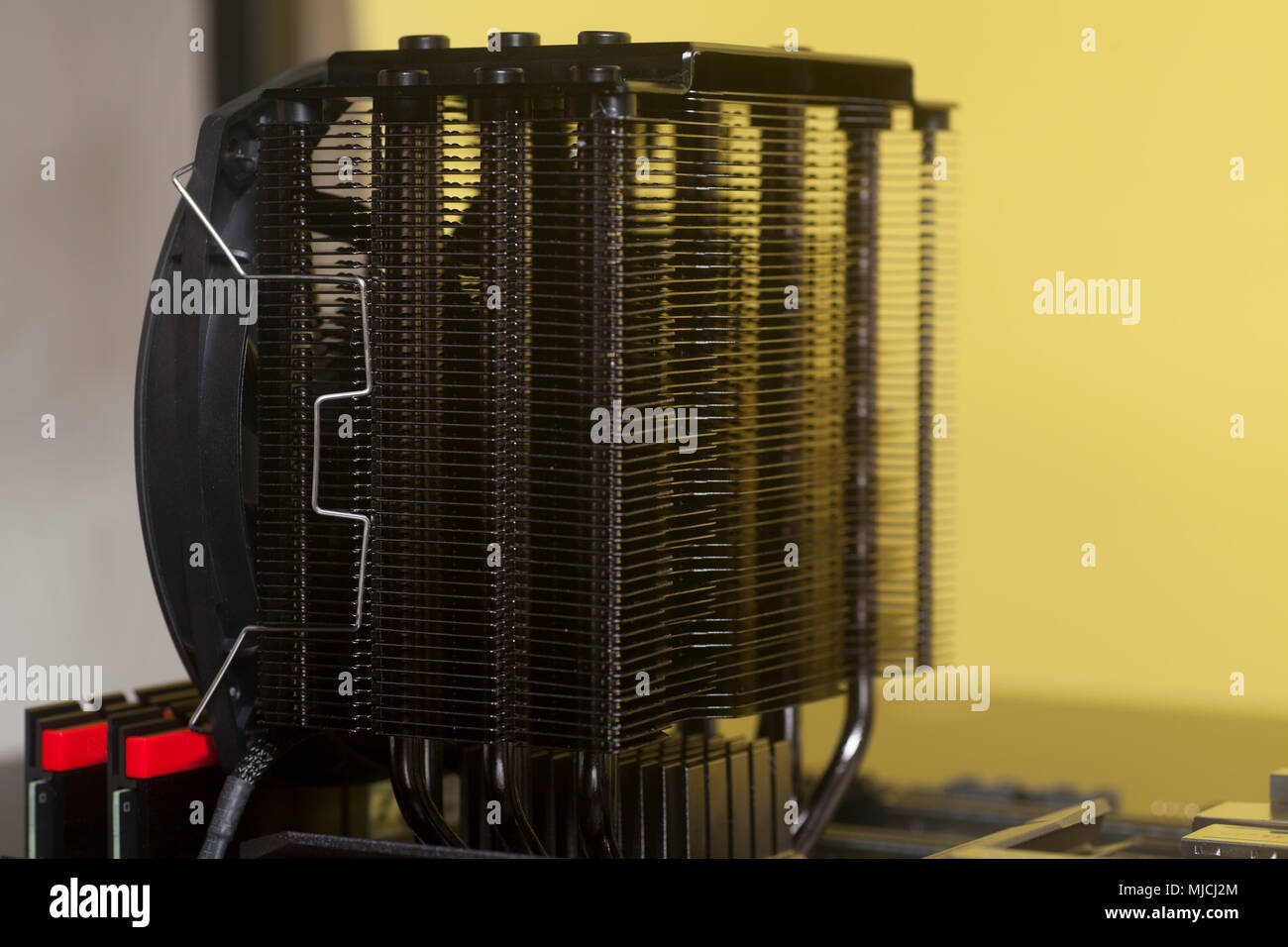 CPU fan processor cooler on a yellow background Stock Photo - Alamy