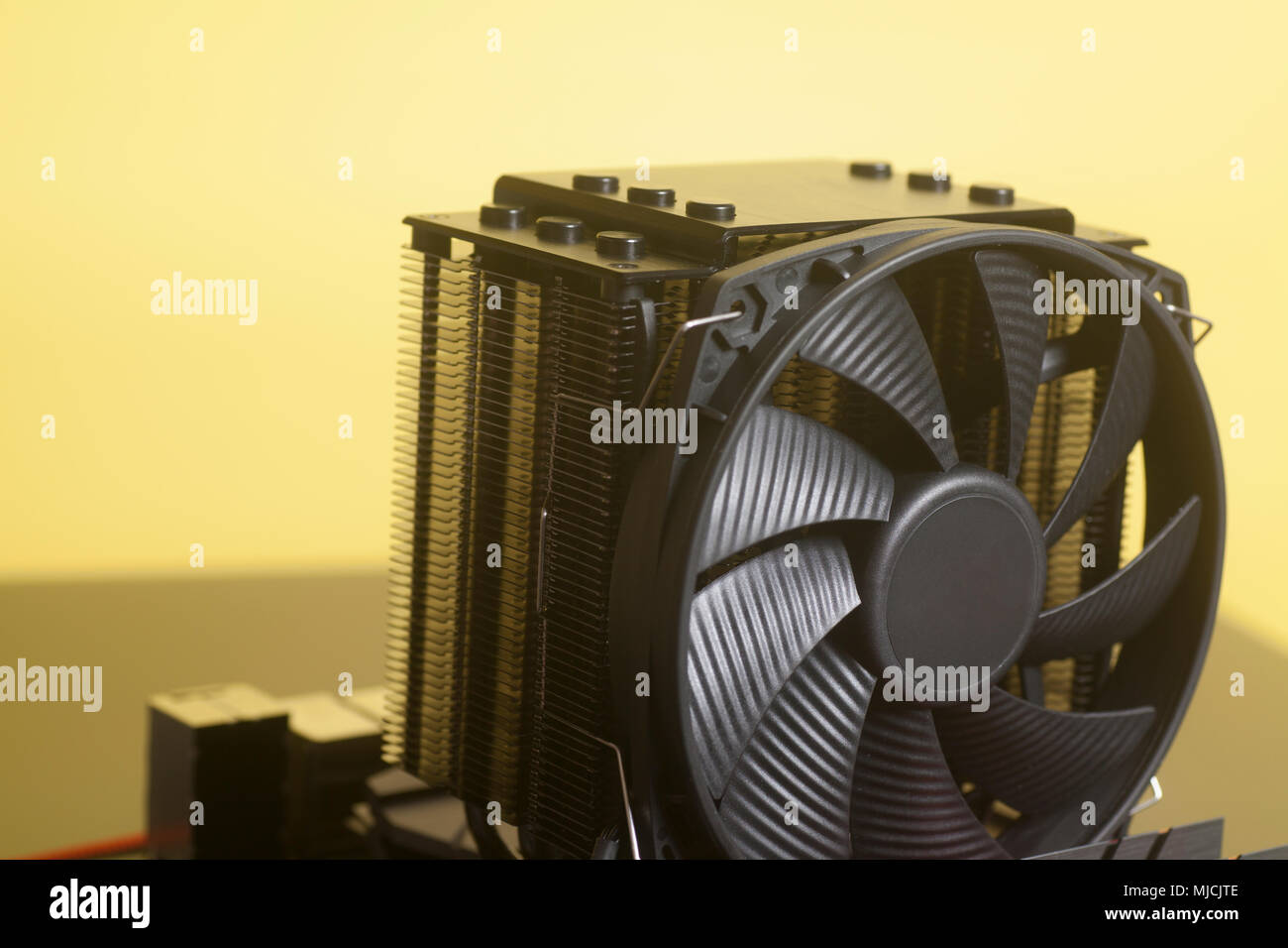 CPU fan processor cooler on a yellow background Stock Photo - Alamy