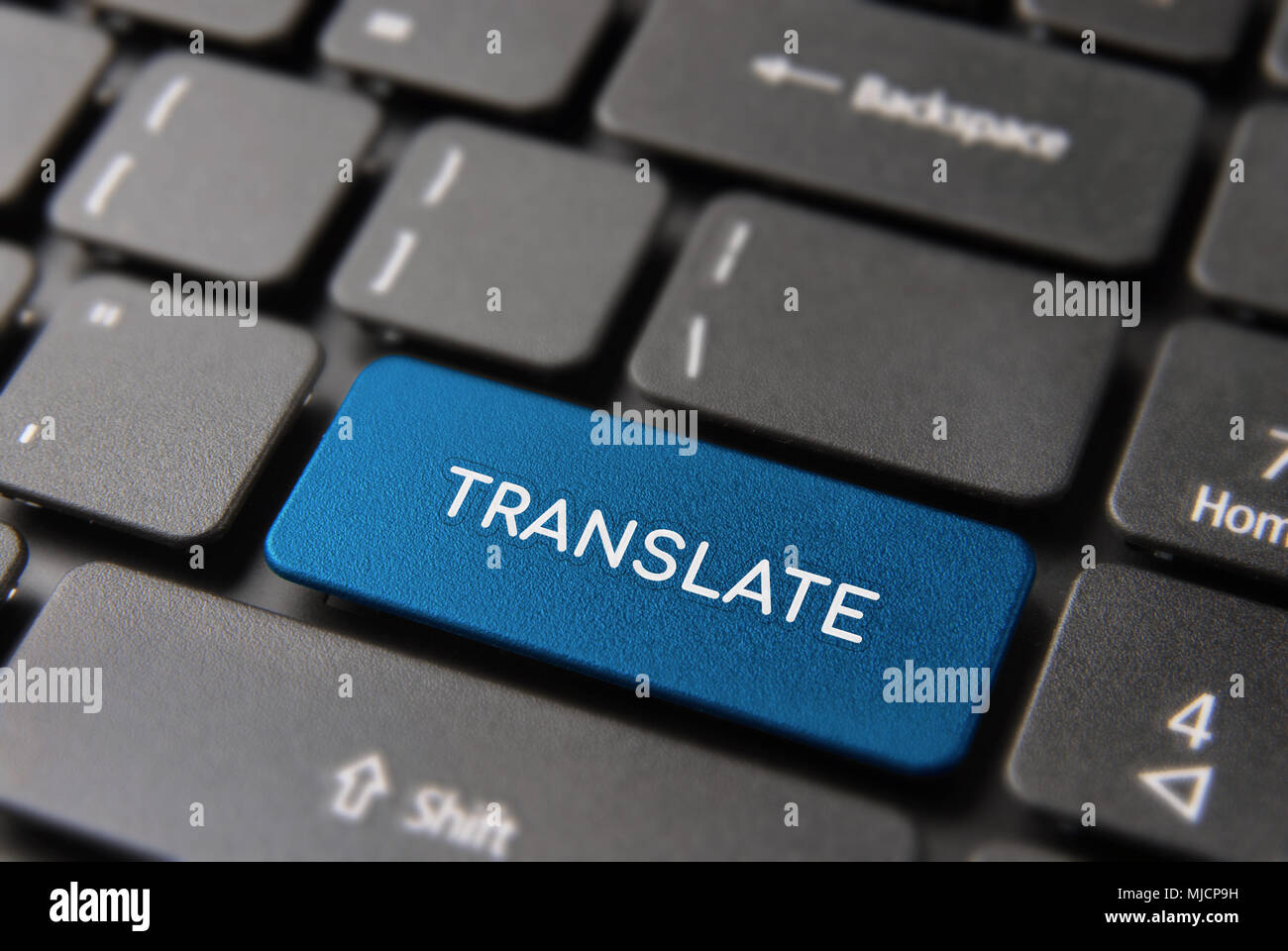 Language translation service concept, red computer button with ...