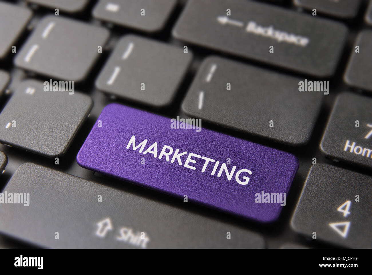 Marketing computer button concept, closeup of keyboard with blue ...